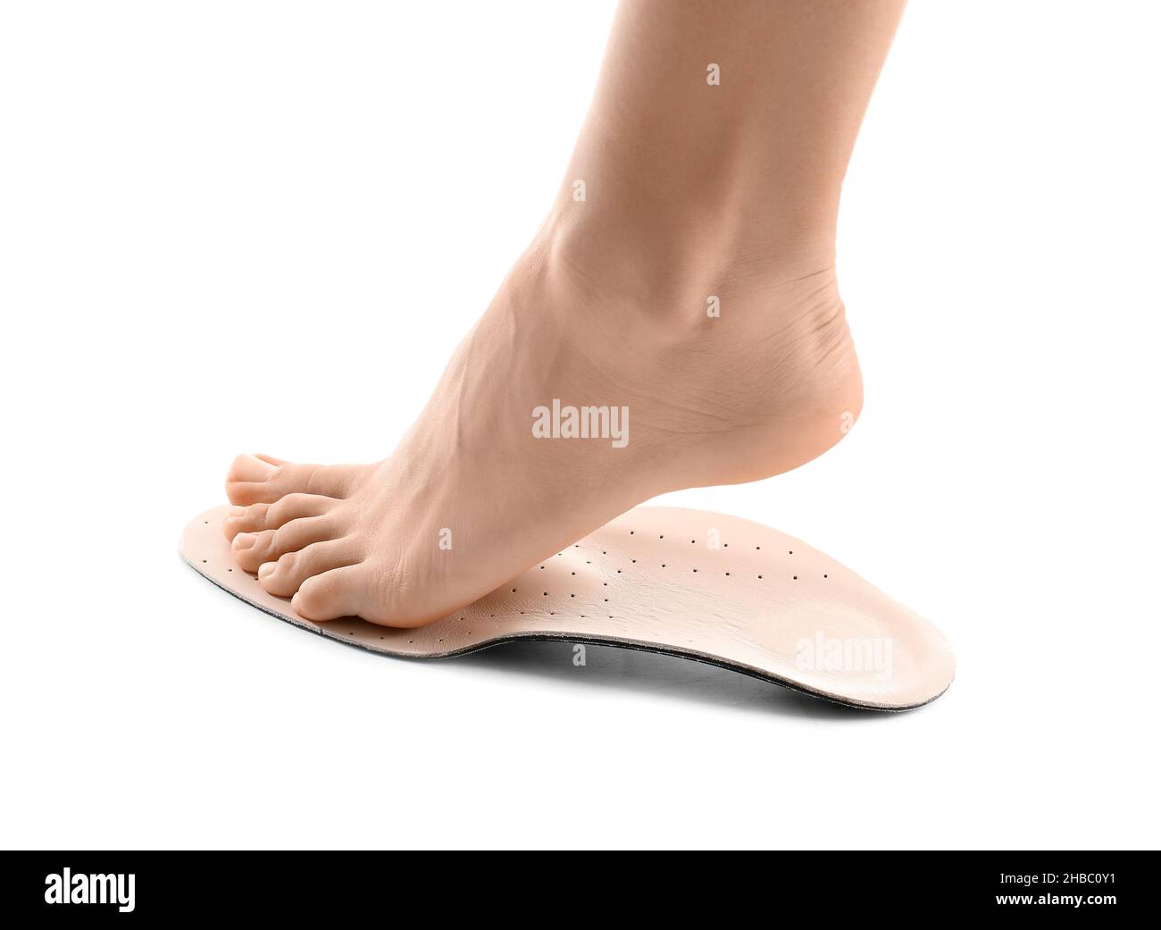 Female foot and orthopedic insole on white background Stock Photo - Alamy