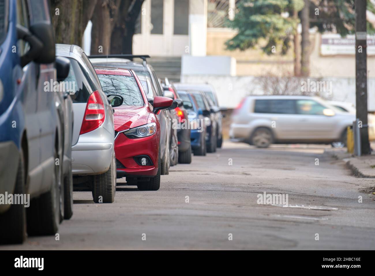 City traffic with cars parked in line on street side Stock Photo - Alamy