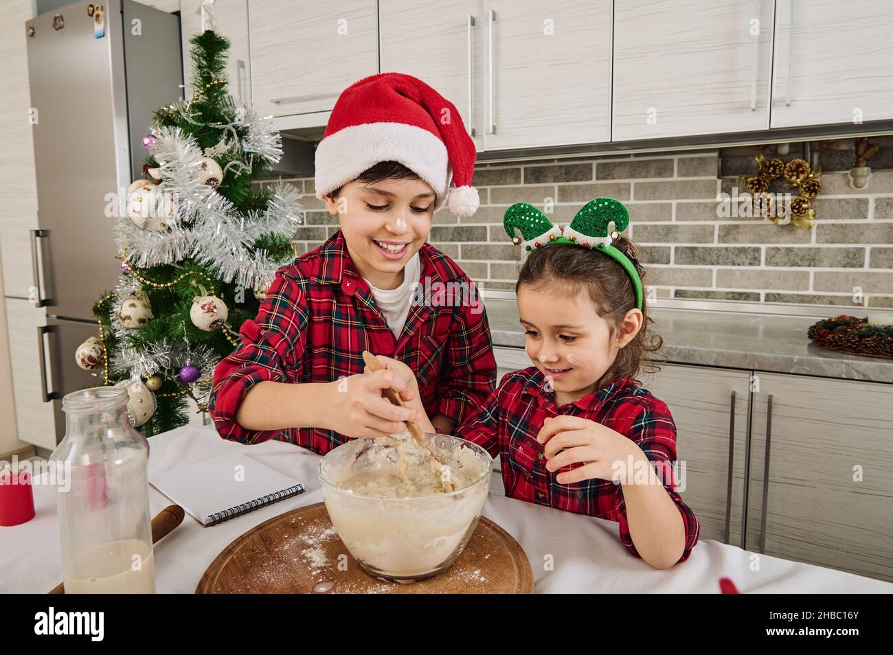 Merry Christmas and happy childhood concept. Cute little girl with elf ...