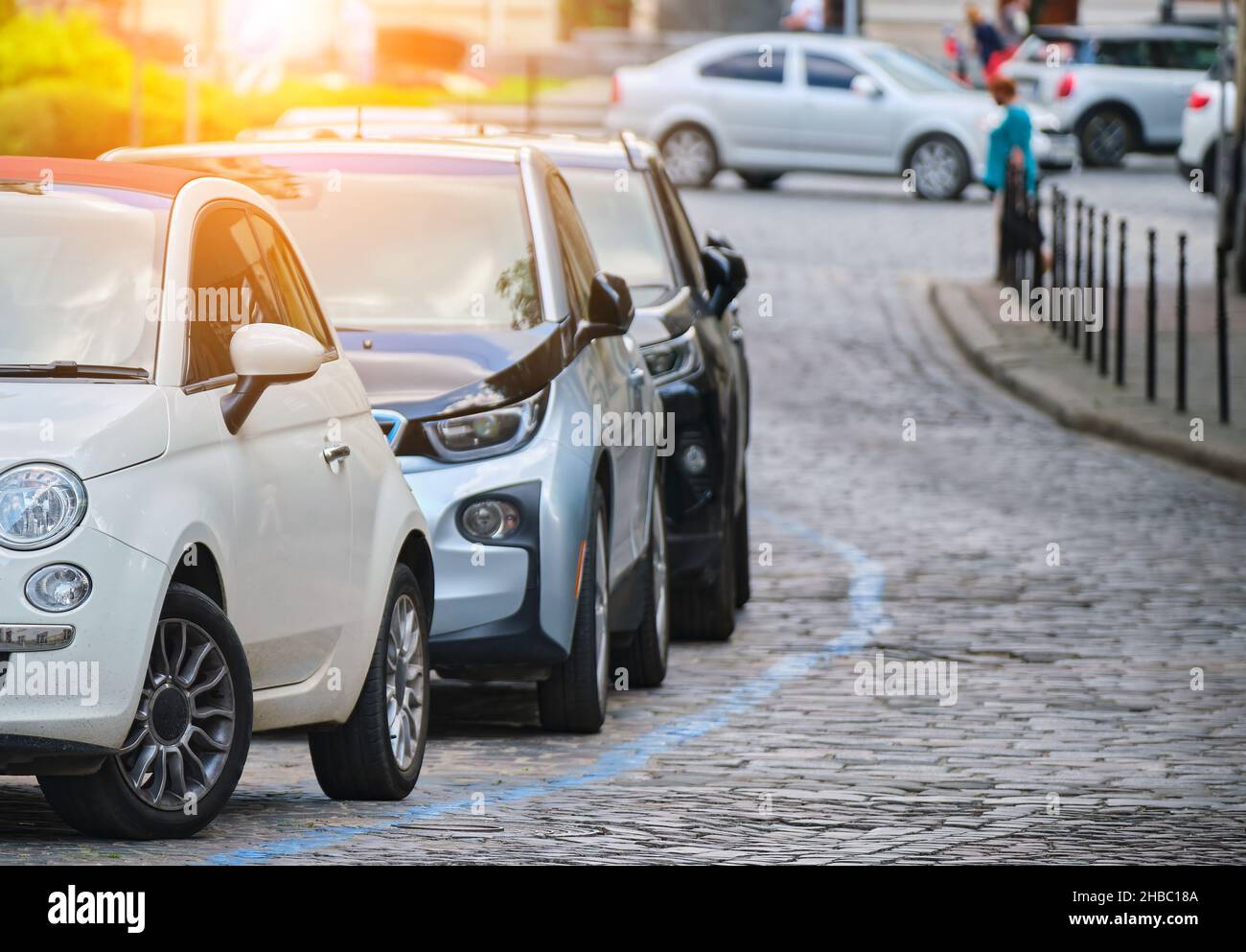 City traffic with cars parked in line on street side Stock Photo - Alamy