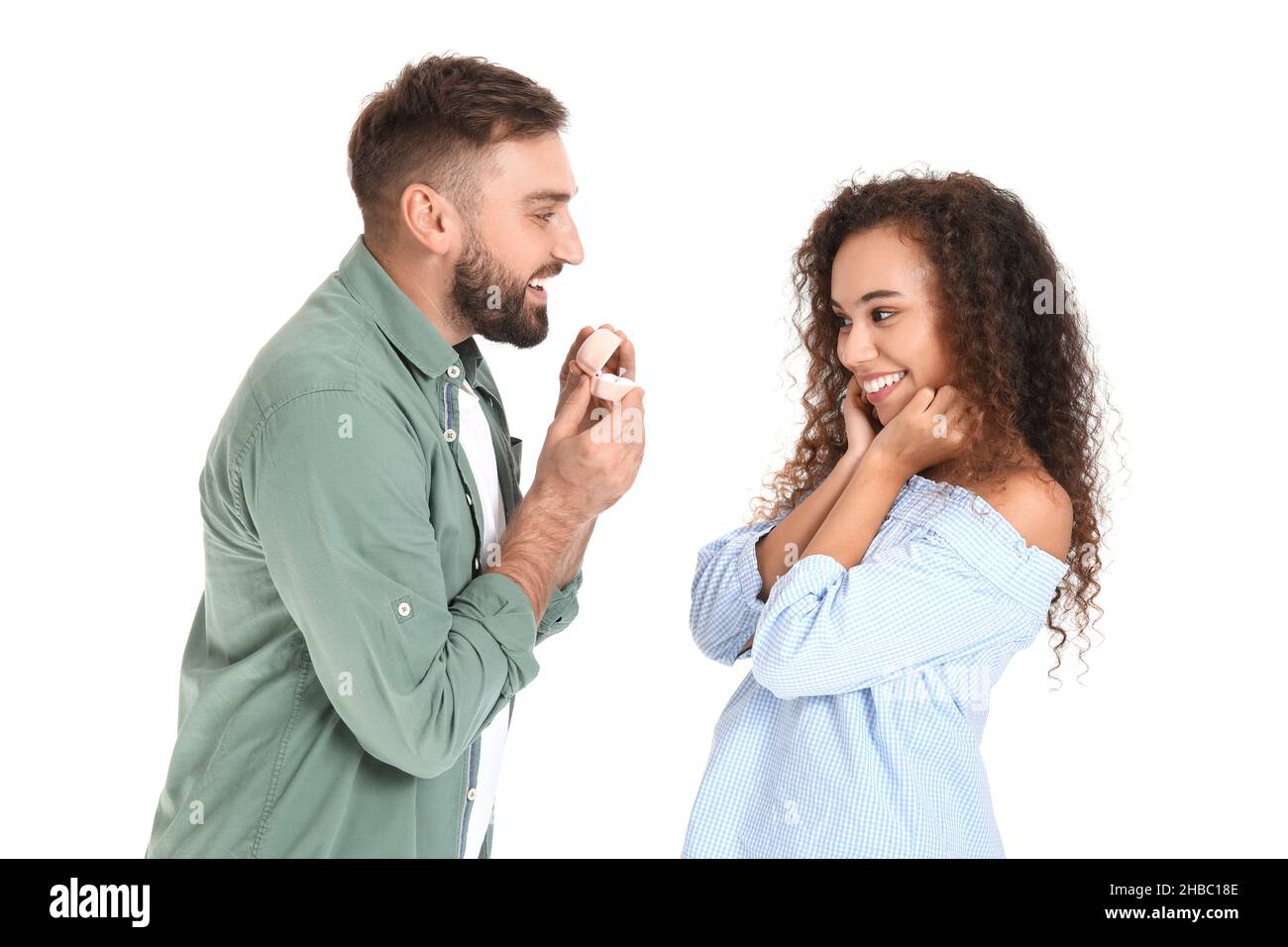 Young man proposing to his girlfriend on white background Stock Photo ...