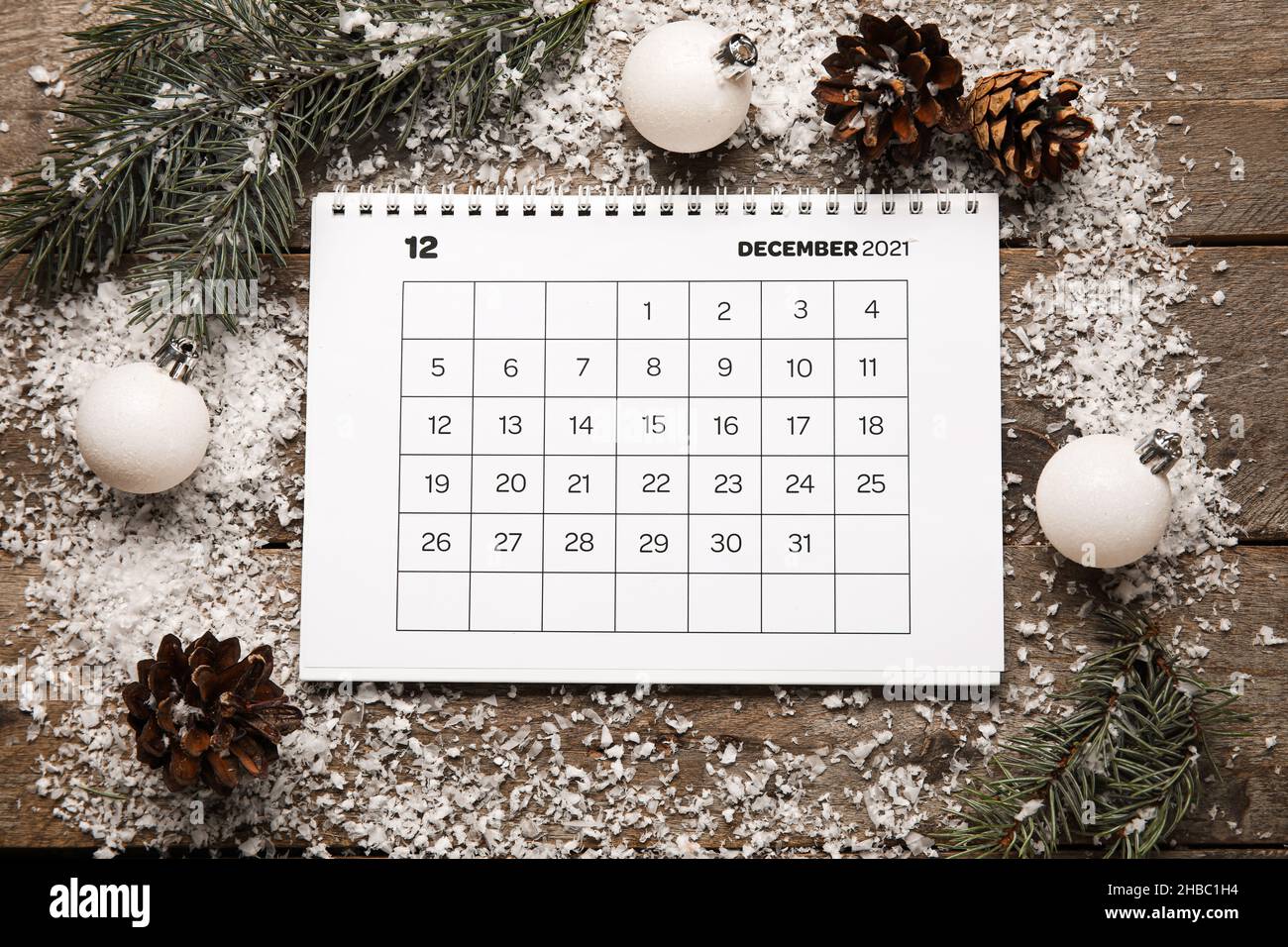 Calendar with date of winter solstice and decorations on wooden ...