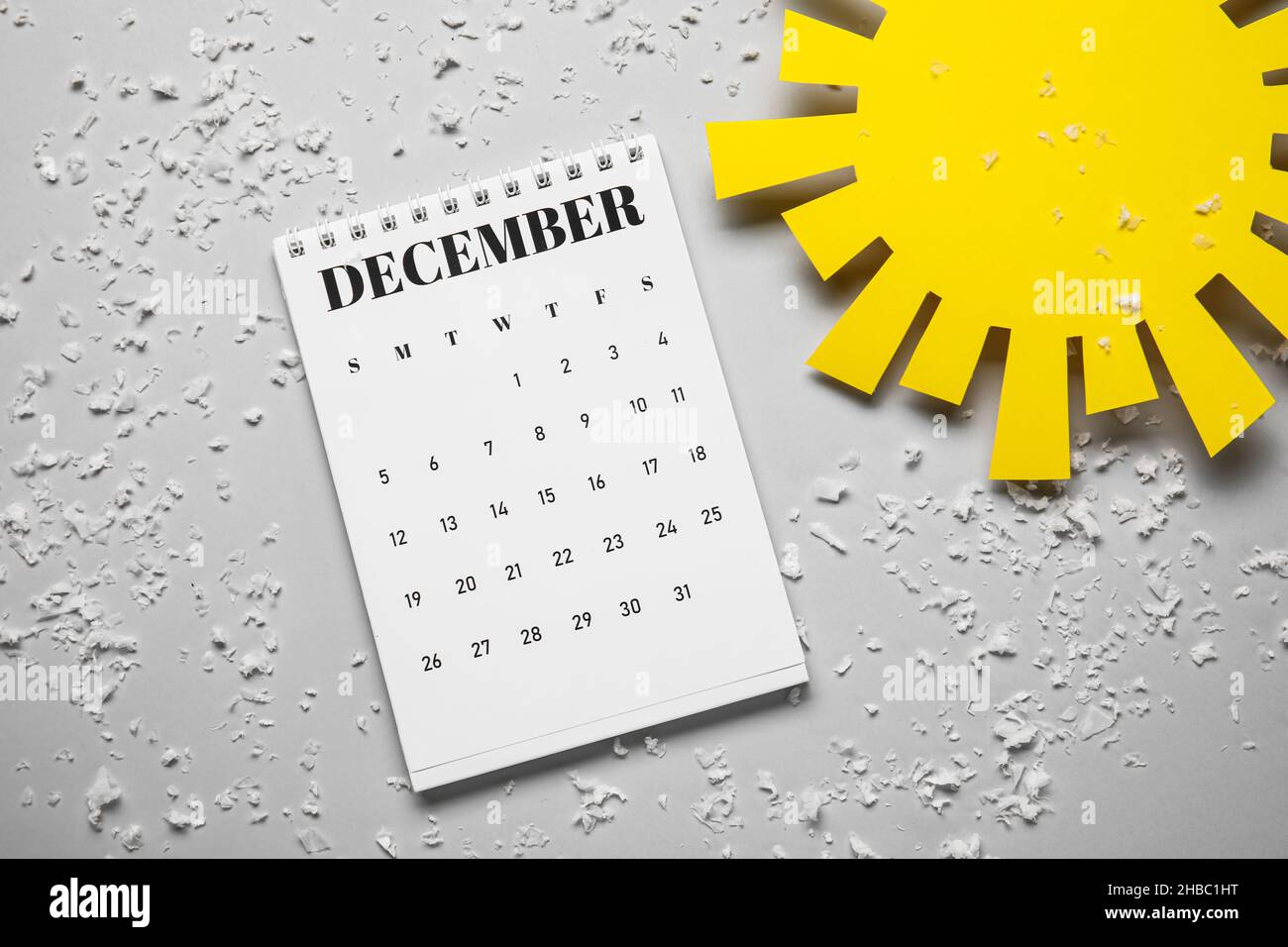 Calendar with date of winter solstice and sun on light background Stock ...