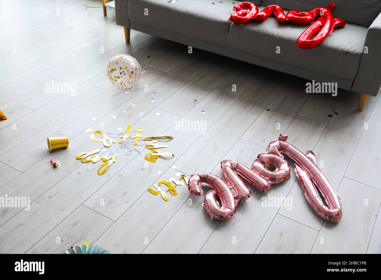 Decor on floor in messy room after party Stock Photo - Alamy
