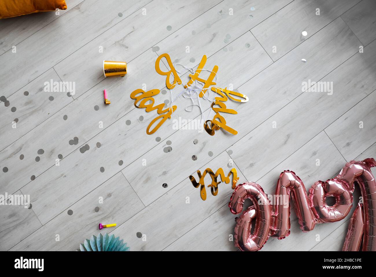 Decor on floor in room after party Stock Photo - Alamy