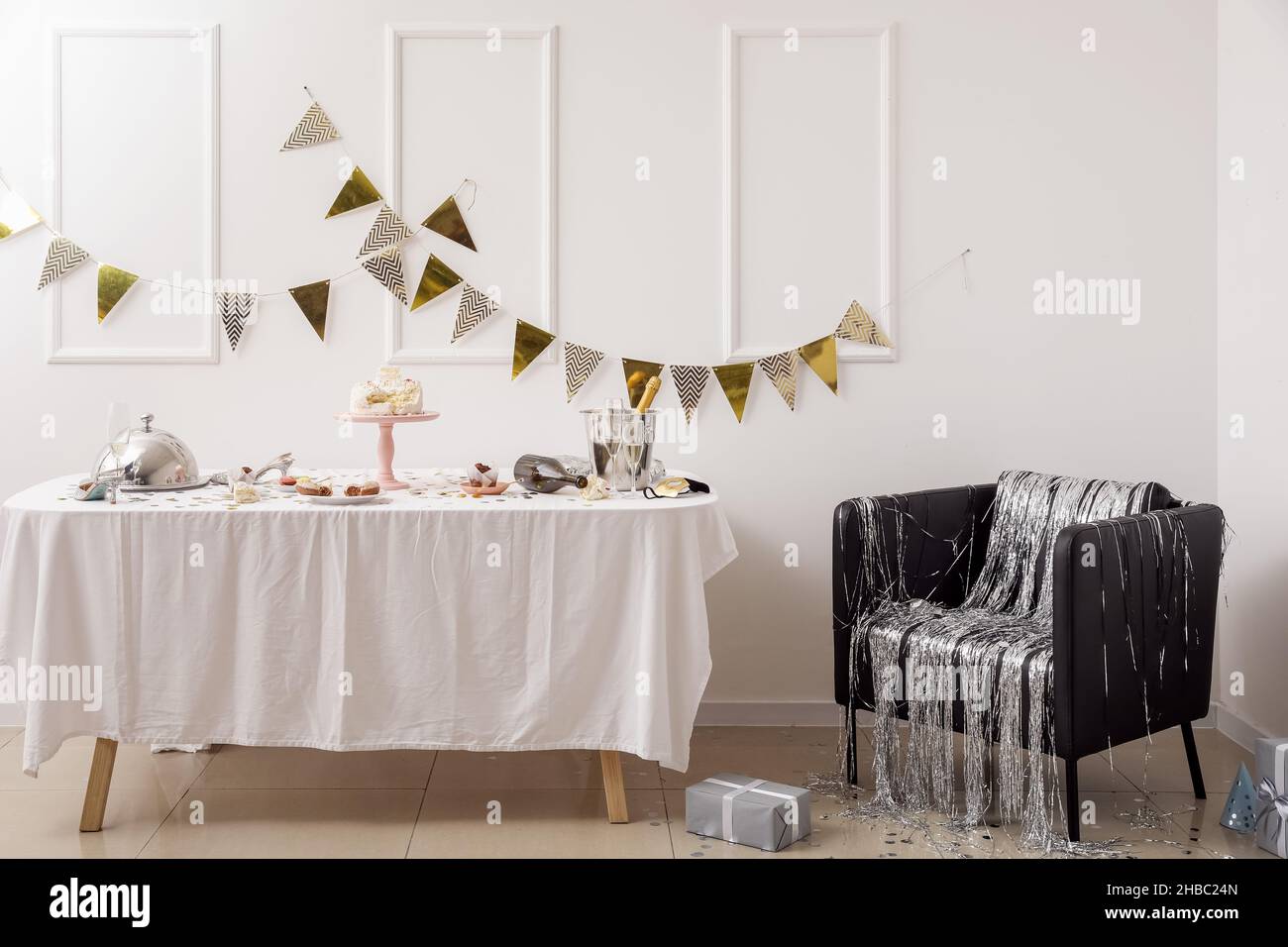 Interior of messy room after party with table and armchair Stock Photo ...