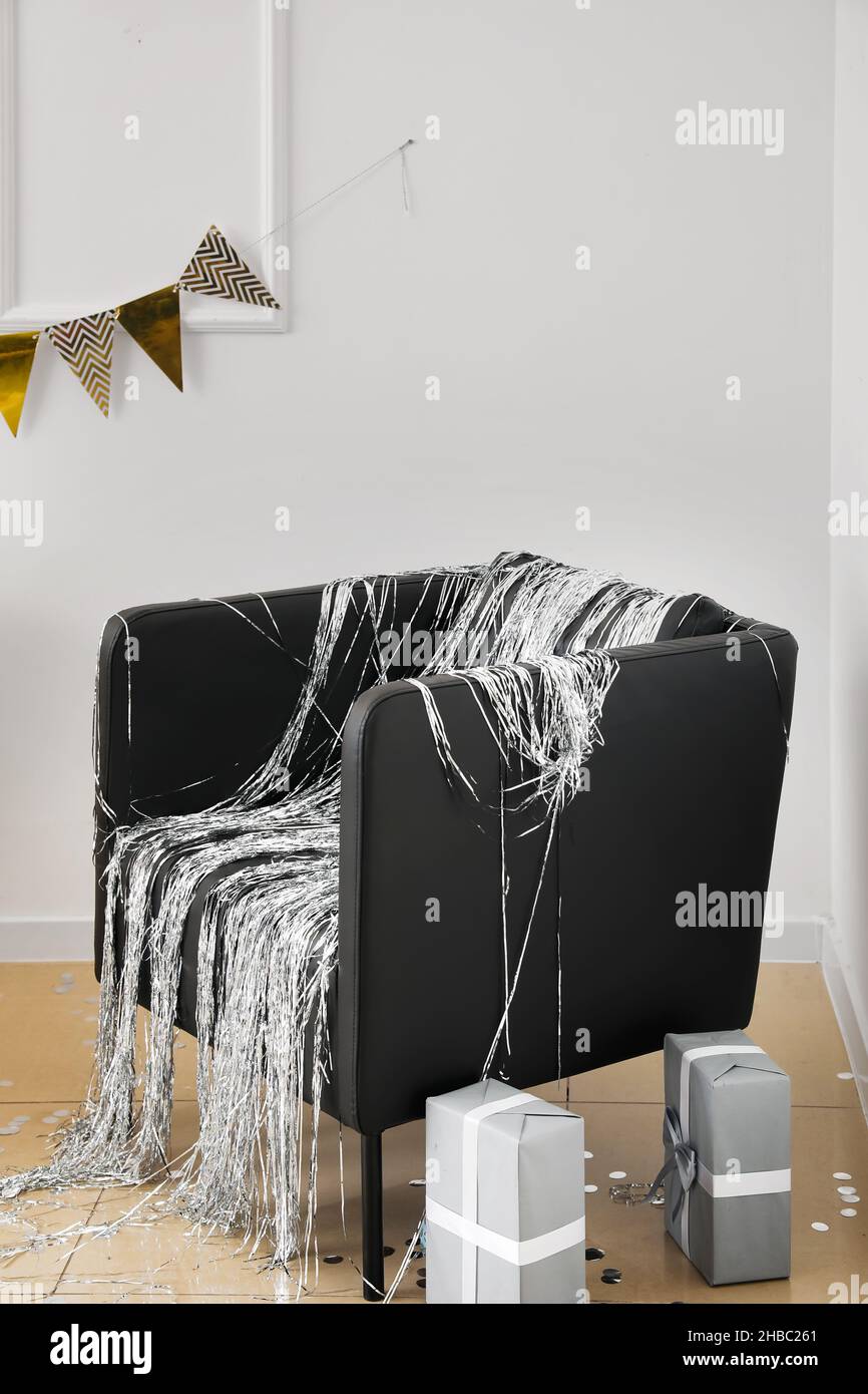 Interior of messy room with armchair after party Stock Photo - Alamy