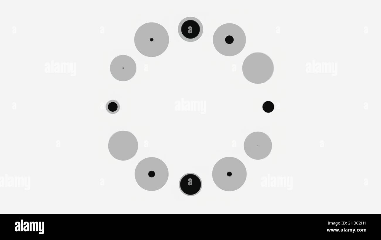 Abstract black and grey spinning bubbles in a rotating loading wheel on ...