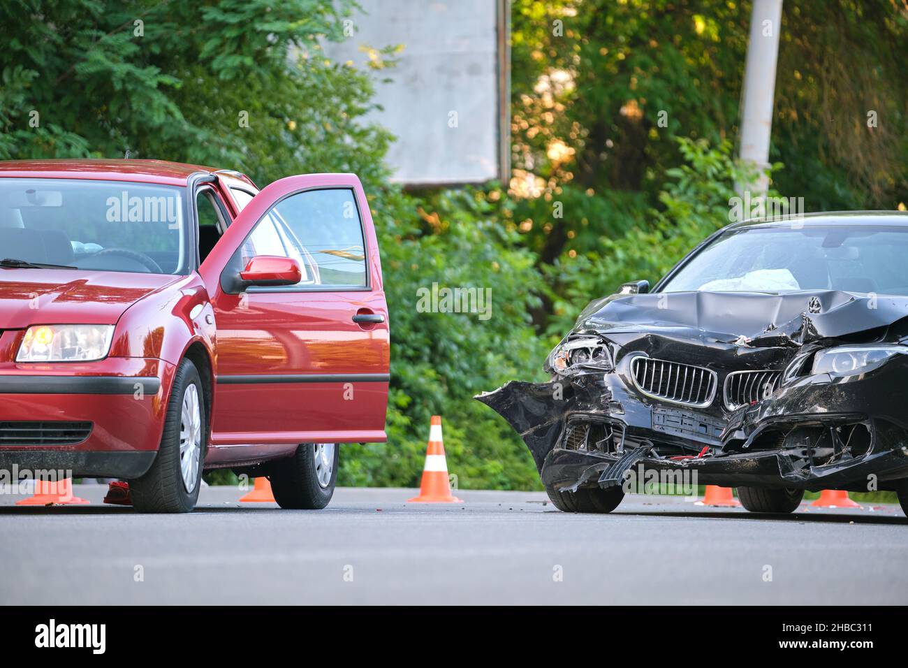 Damaged in heavy car accident vehicles after collision on city street ...