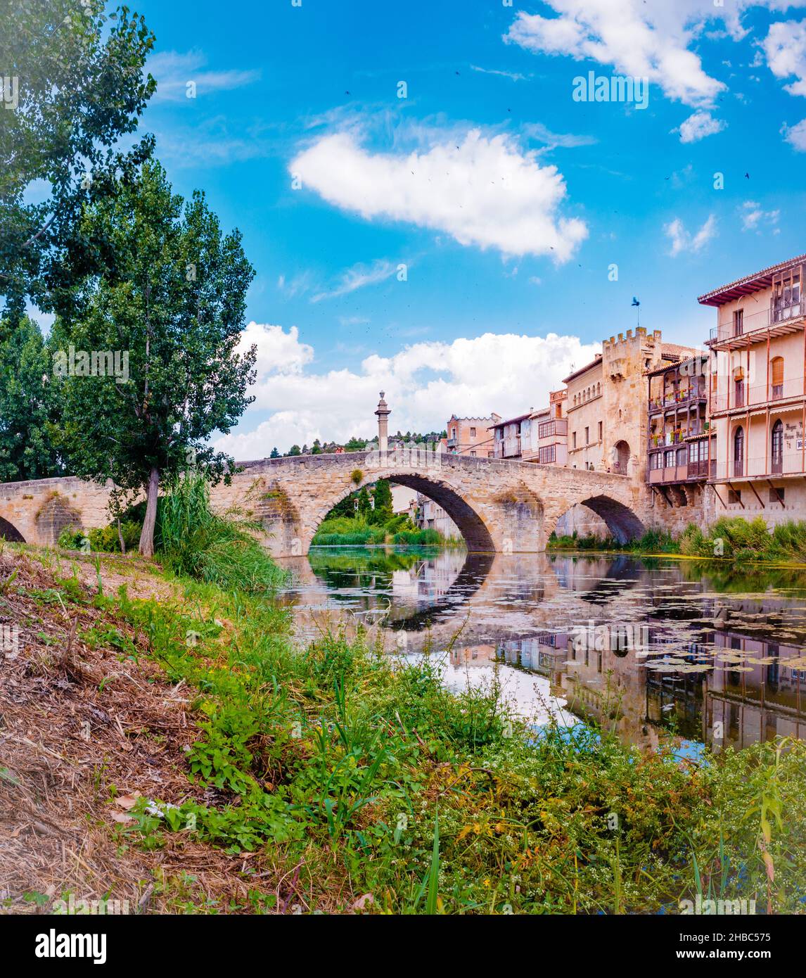 Valderrobres, Spain - July 7, 2021: Stone bridge over the river makes ...