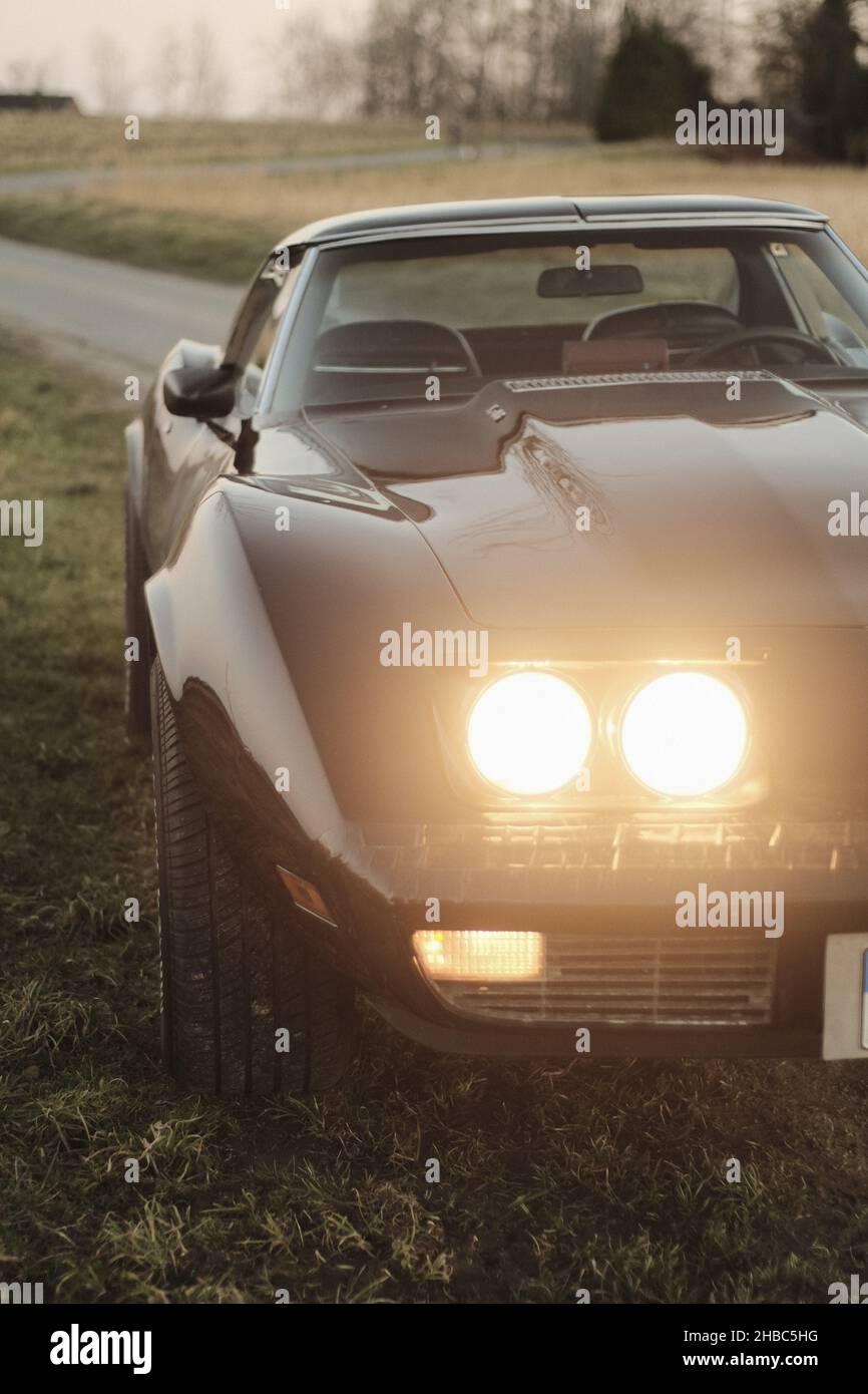 Burning headlights of a retro car Stock Photo - Alamy