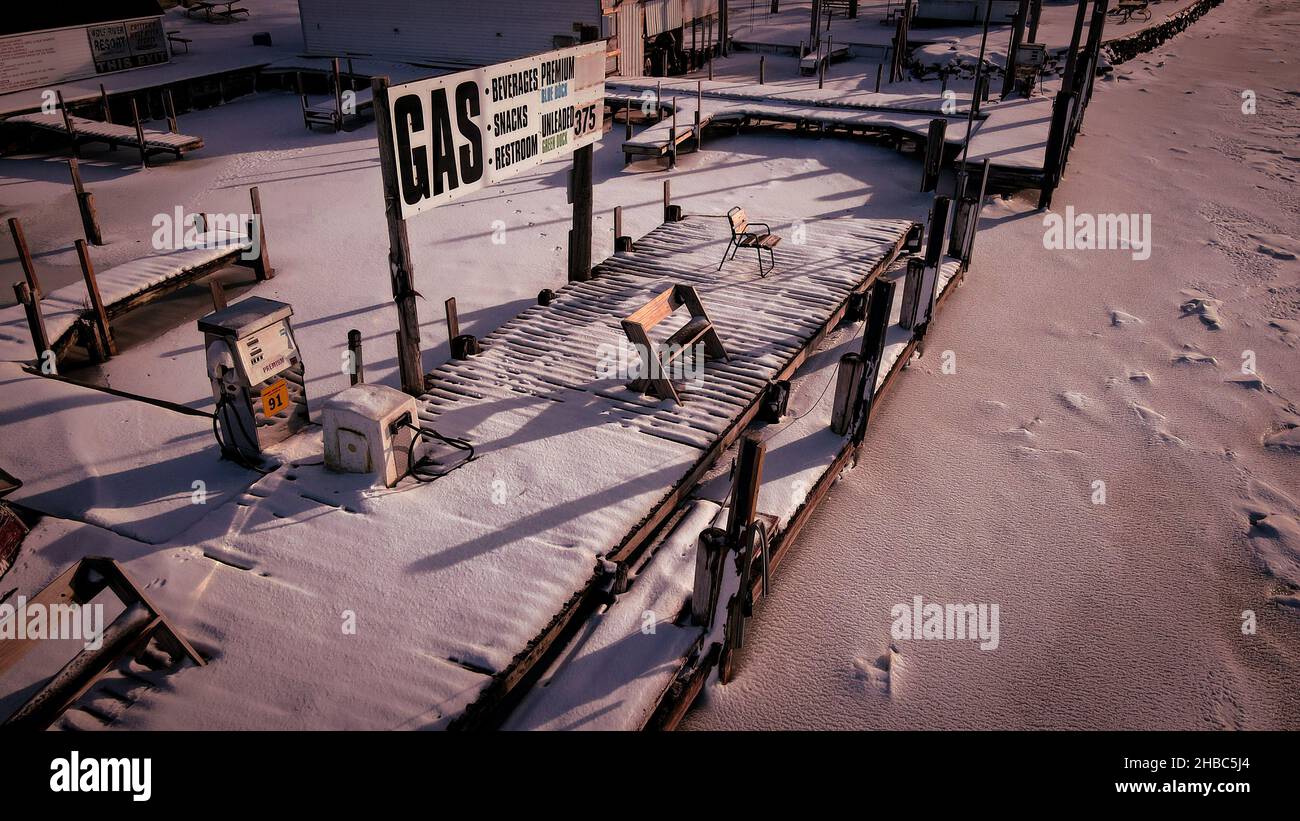 A scene of winter landscape with snow covered docks Stock Photo - Alamy