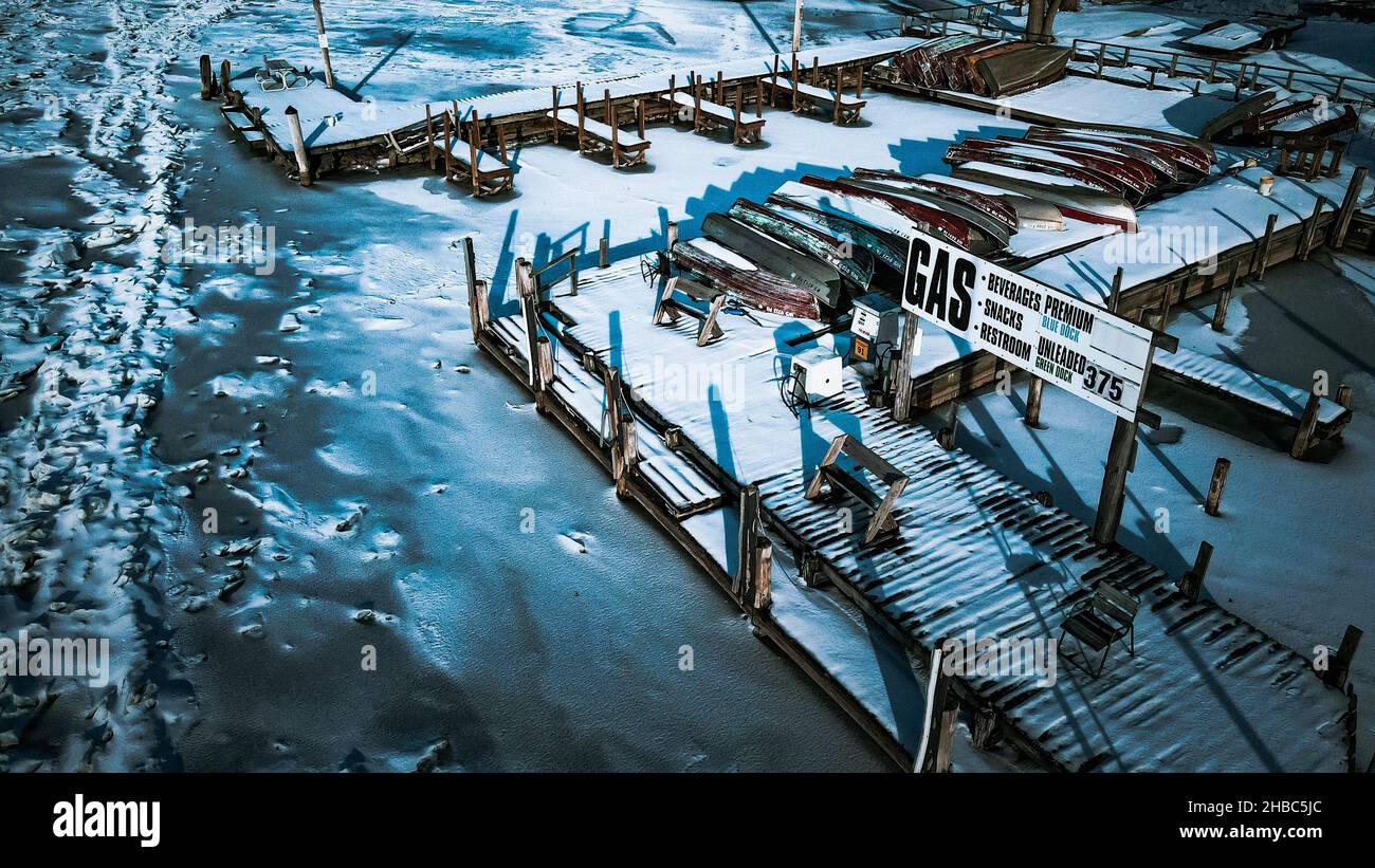 A scene of winter landscape with snow covered docks Stock Photo - Alamy
