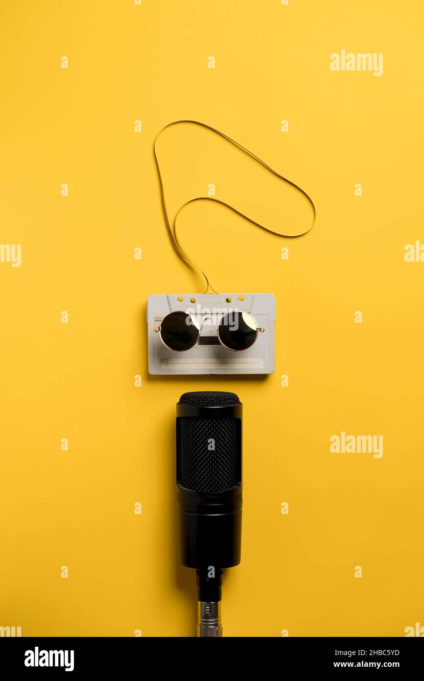 Retro audiotape with magnetic tape in sunglasses and a modern ...