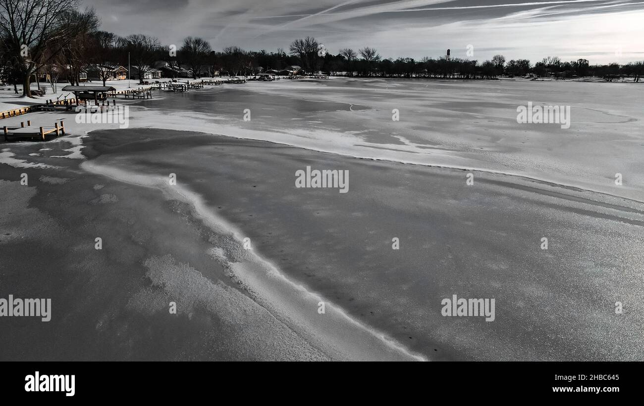 Scenic view of frozen lake with docks Stock Photo - Alamy