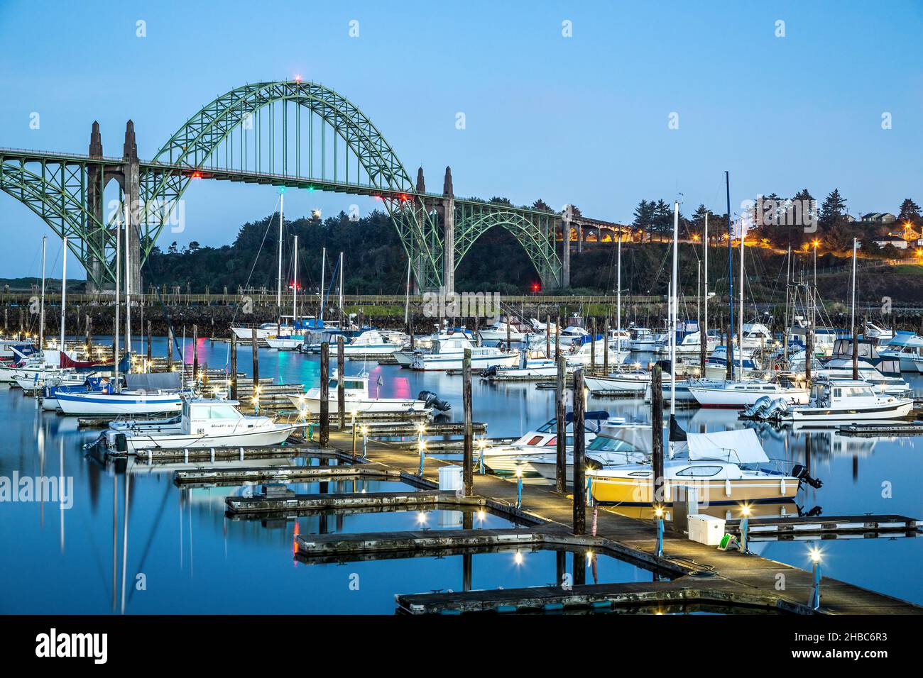 Boats moored in Port of Newport Marina and Yaquina Bay Bridge, Newport ...
