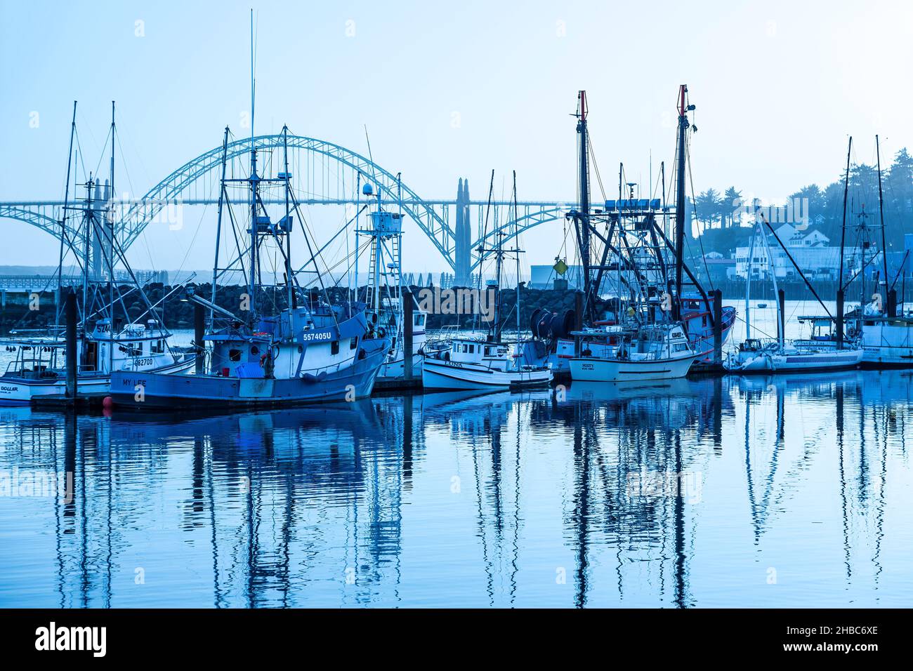 Fishing boats and Yaquina Bay Bridge, Port of Newport, Oregon USA Stock ...