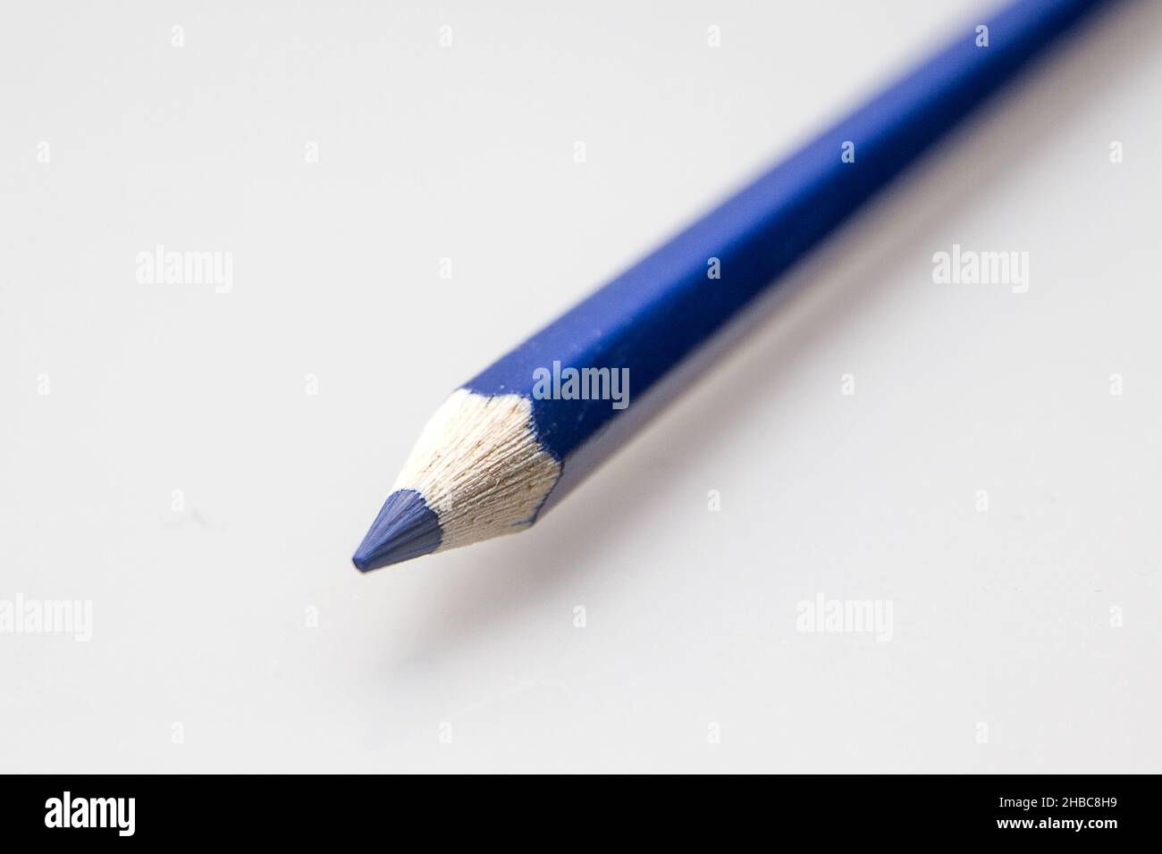 Close-up shot of a blue colored pencil for drawing isolated on a white ...