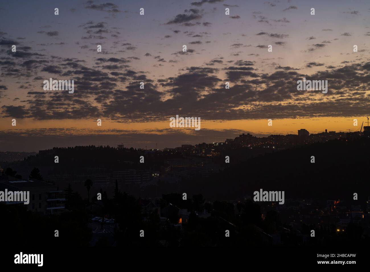 The partially cloudy sky over Jerusalem, Israel turn red at dawn Stock ...