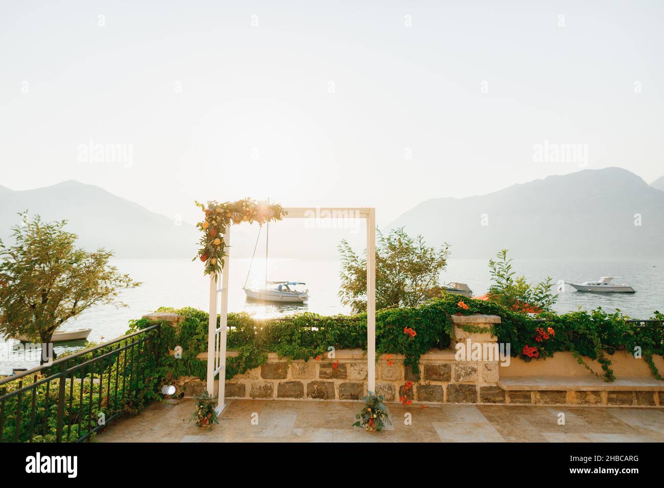 Wedding arch decorated with flowers on the observation deck overlooking ...