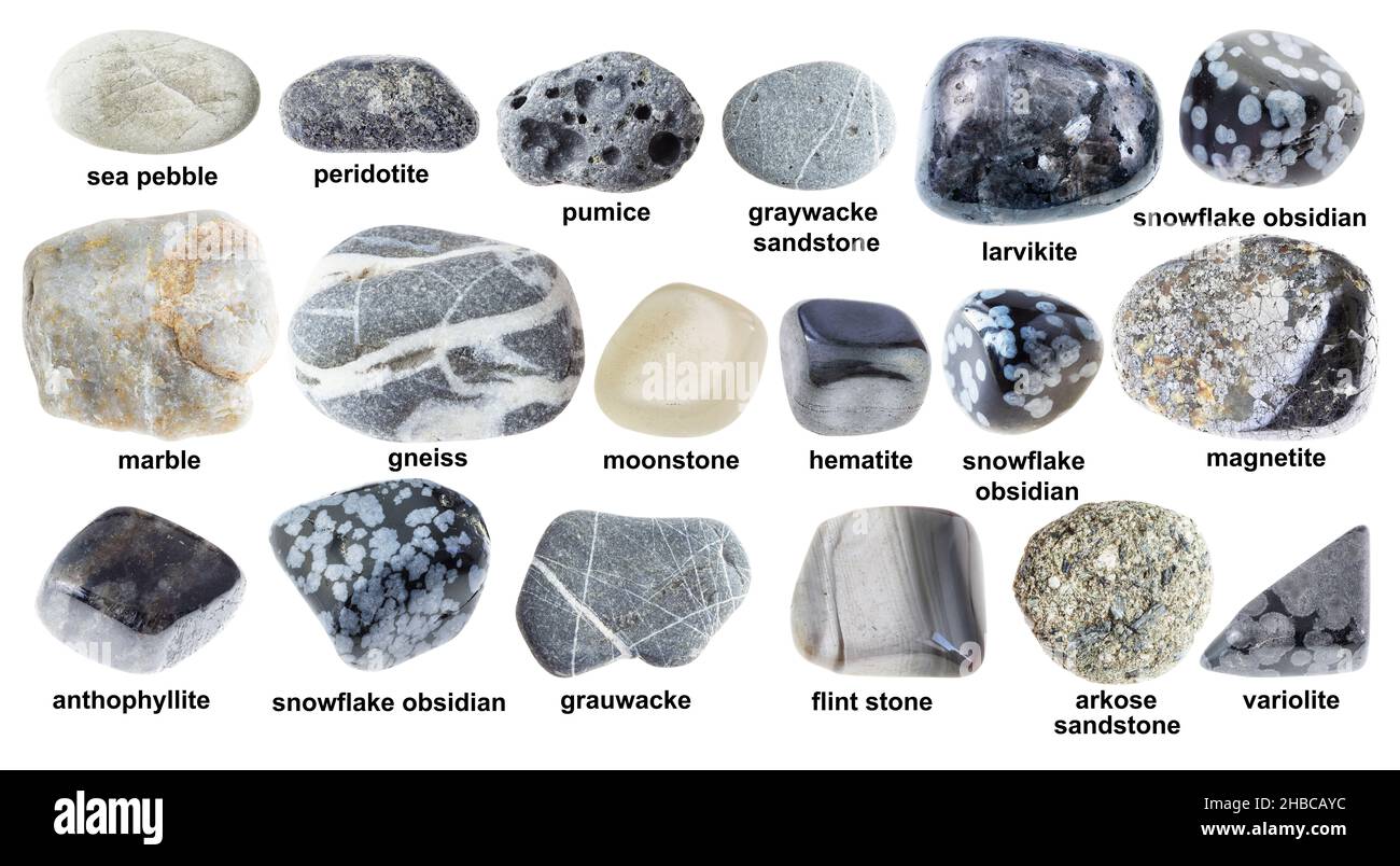 set of various tumbled black stones with names cutout on white ...