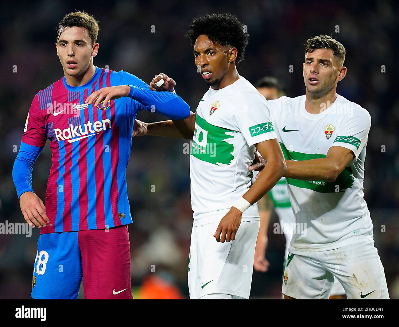 Nico Gonzalez of FC Barcelona and Johan Mojica and Lucas Boye of Elche ...