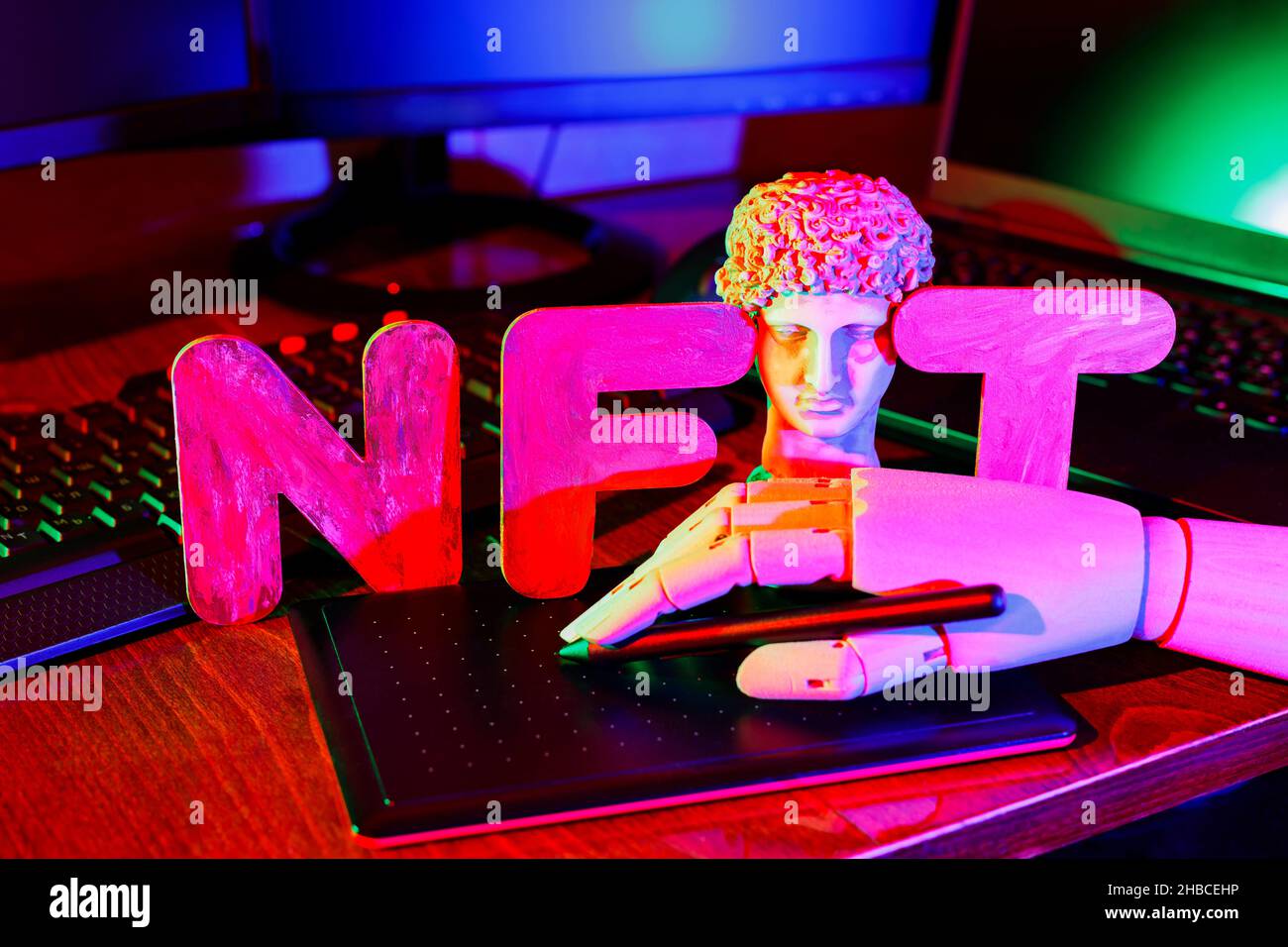 NFT (Non-Fungible token). Artificial hand creates crypto art using a ...