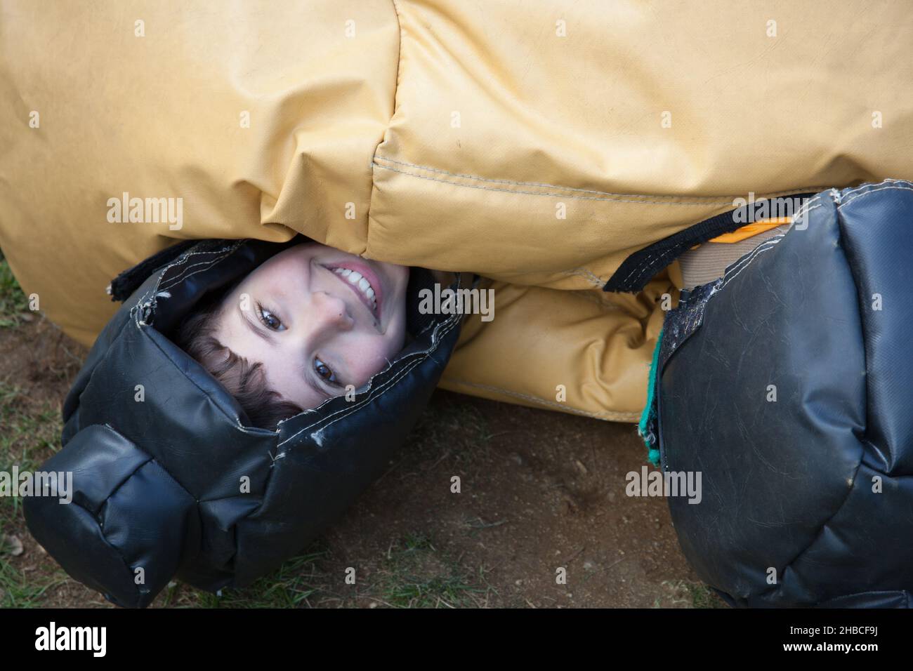 A twelve year old boy in a scout camp in a sumo wreslting suit Stock ...