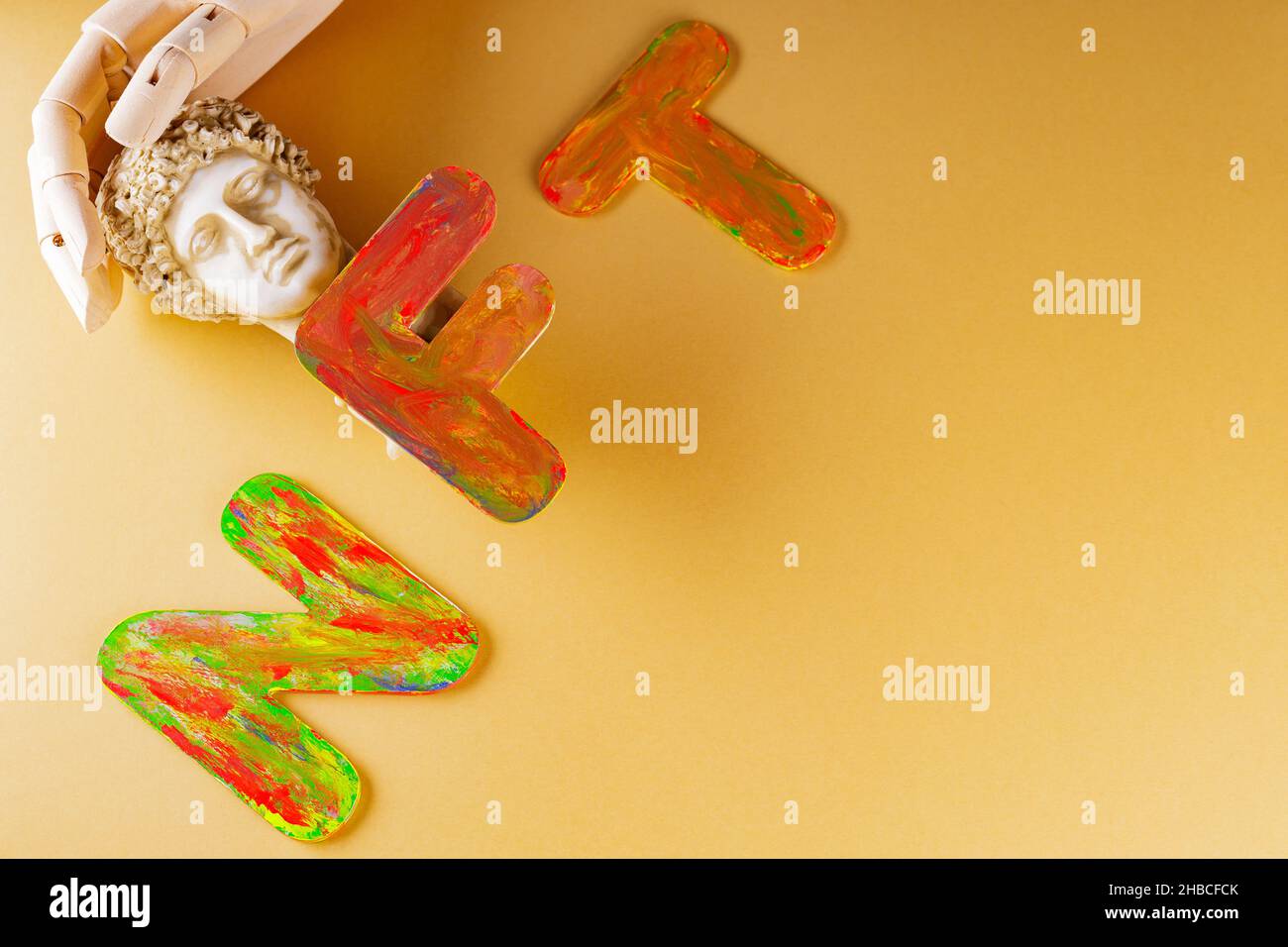 NFT (Non-Fungible token). Artificial fingers hug the plaster head of ...