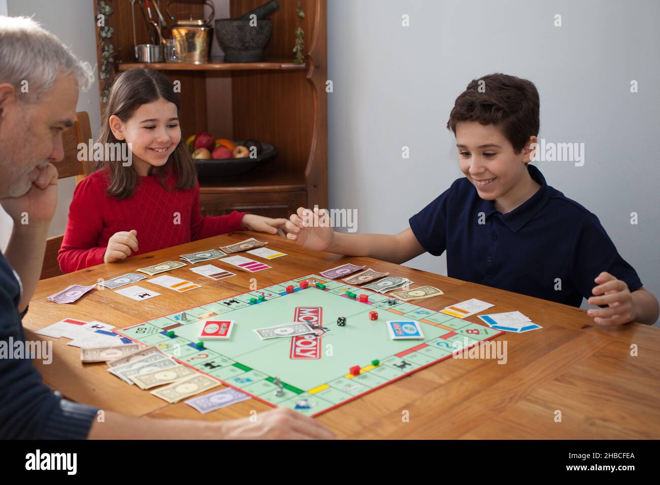 Candid family board game hi-res stock photography and images - Alamy