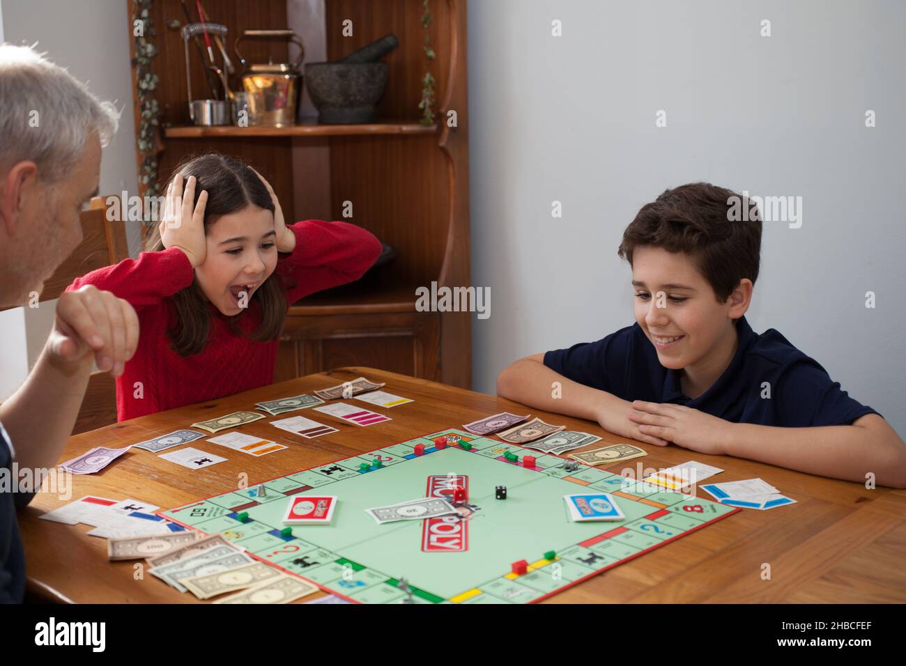 Candid family board game hi-res stock photography and images - Alamy