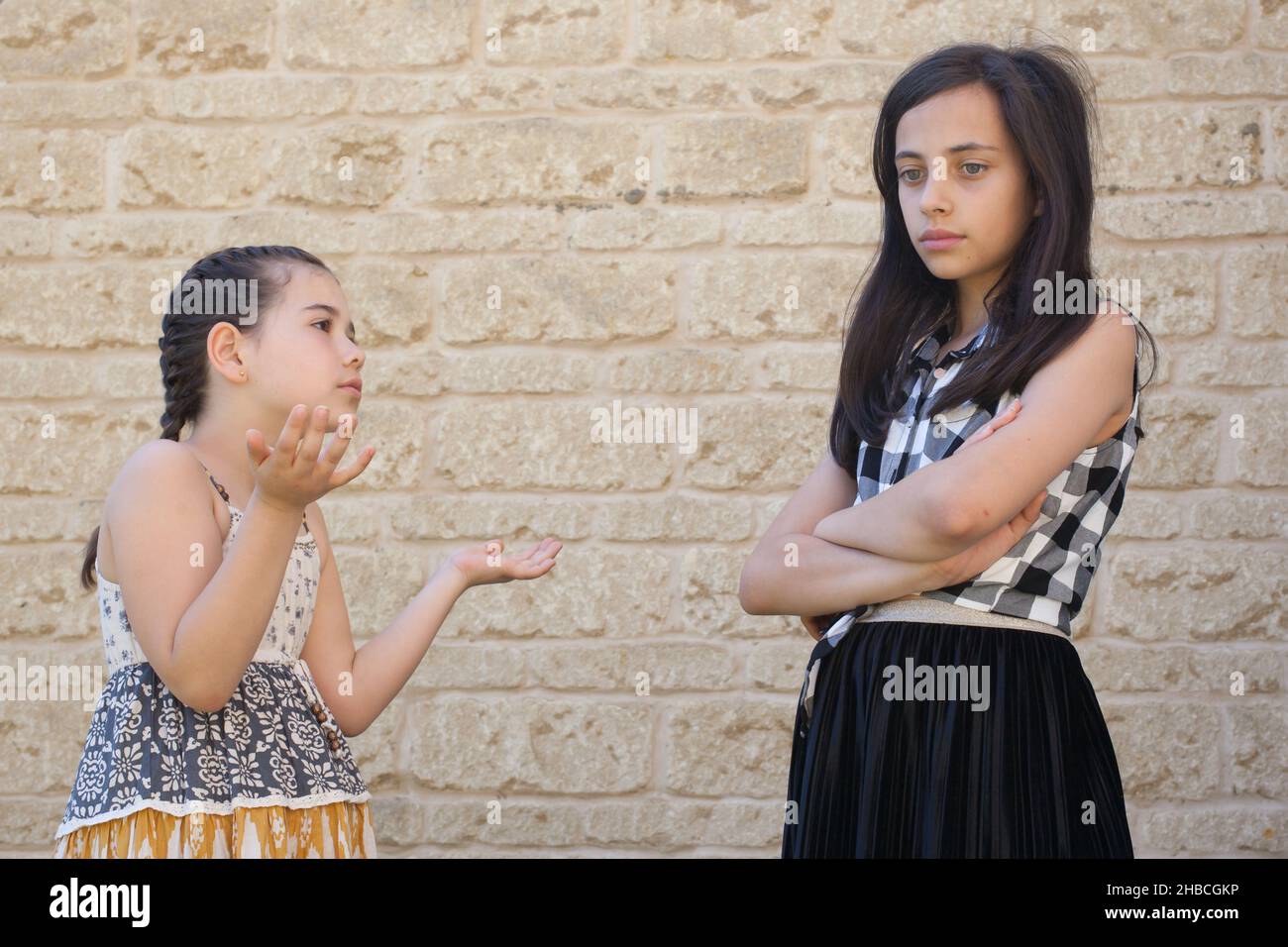 Two girls who have fallen out being upset with each other Stock Photo ...