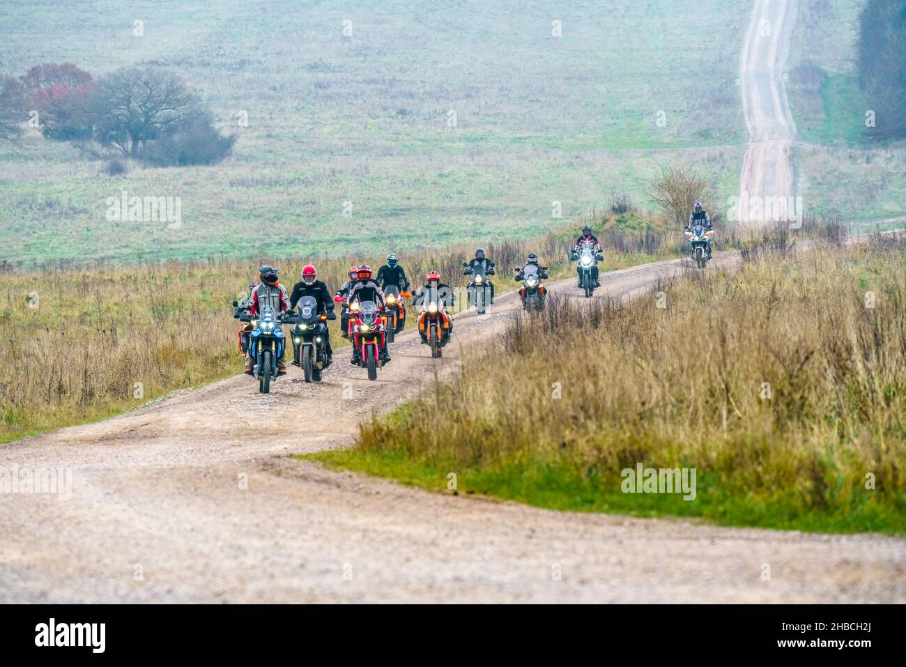 a group of motor cyclists (bikers) riding their off-road motorbikes ...