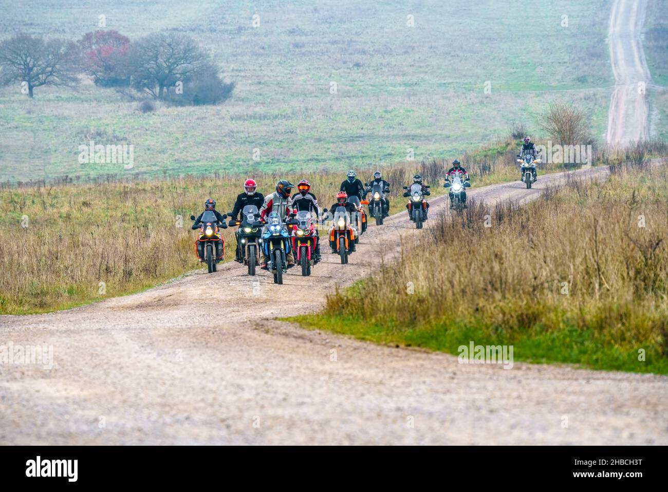 a group of motor cyclists (bikers) riding their off-road motorbikes ...