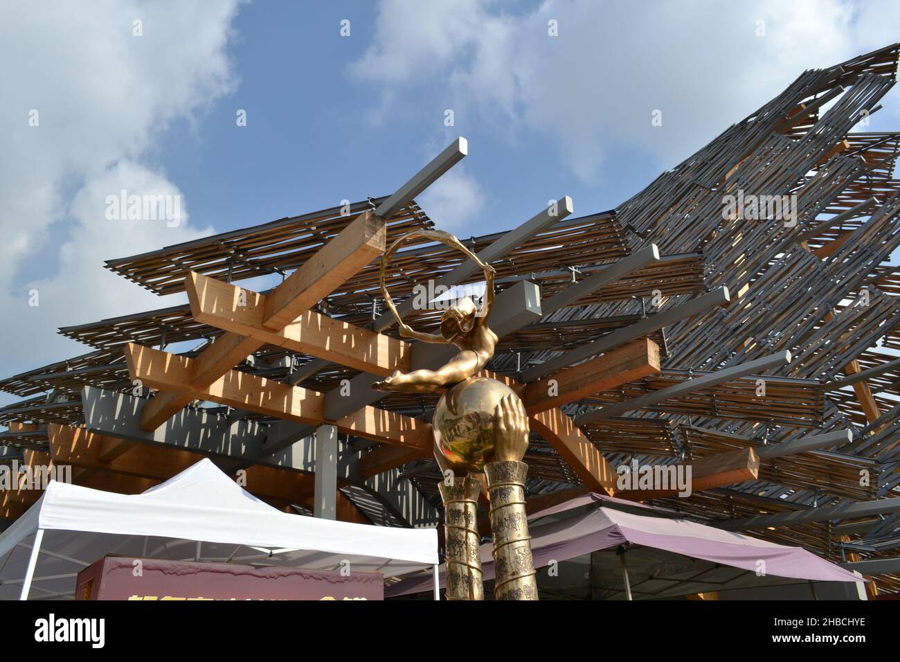 Gilded bronze sculpture of young naked gymnast above globe with ...
