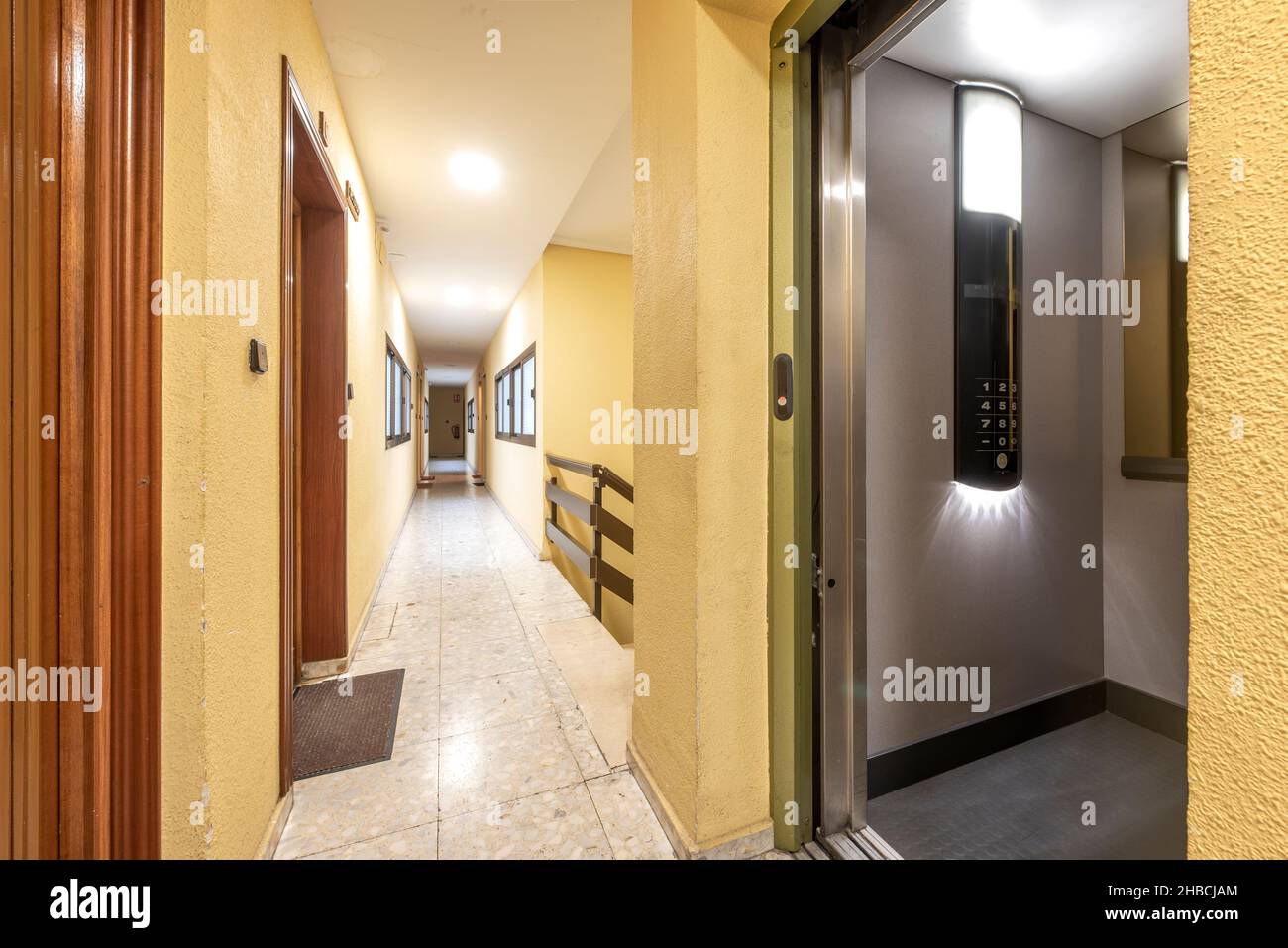 Community hallway in the staircase of an apartment building at the exit ...