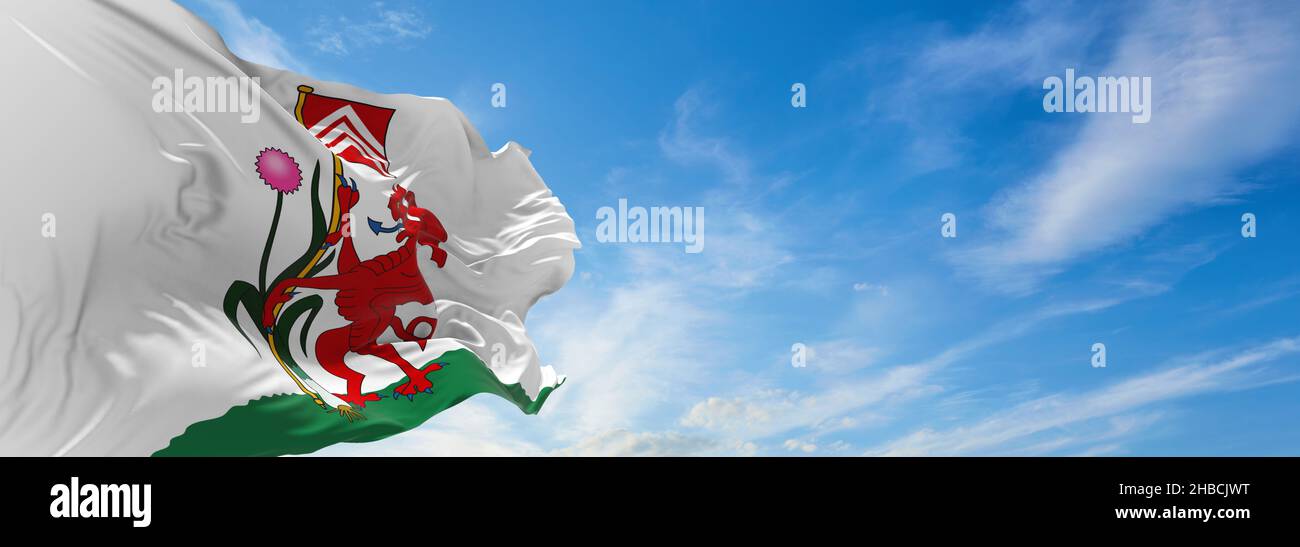 flag of Cardiff at cloudy sky background on sunset. panoramic view ...