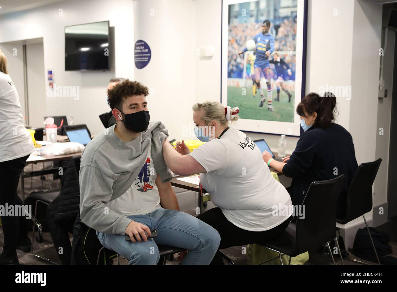 A NHS staff from the vaccination team administers a Covid-19 booster ...