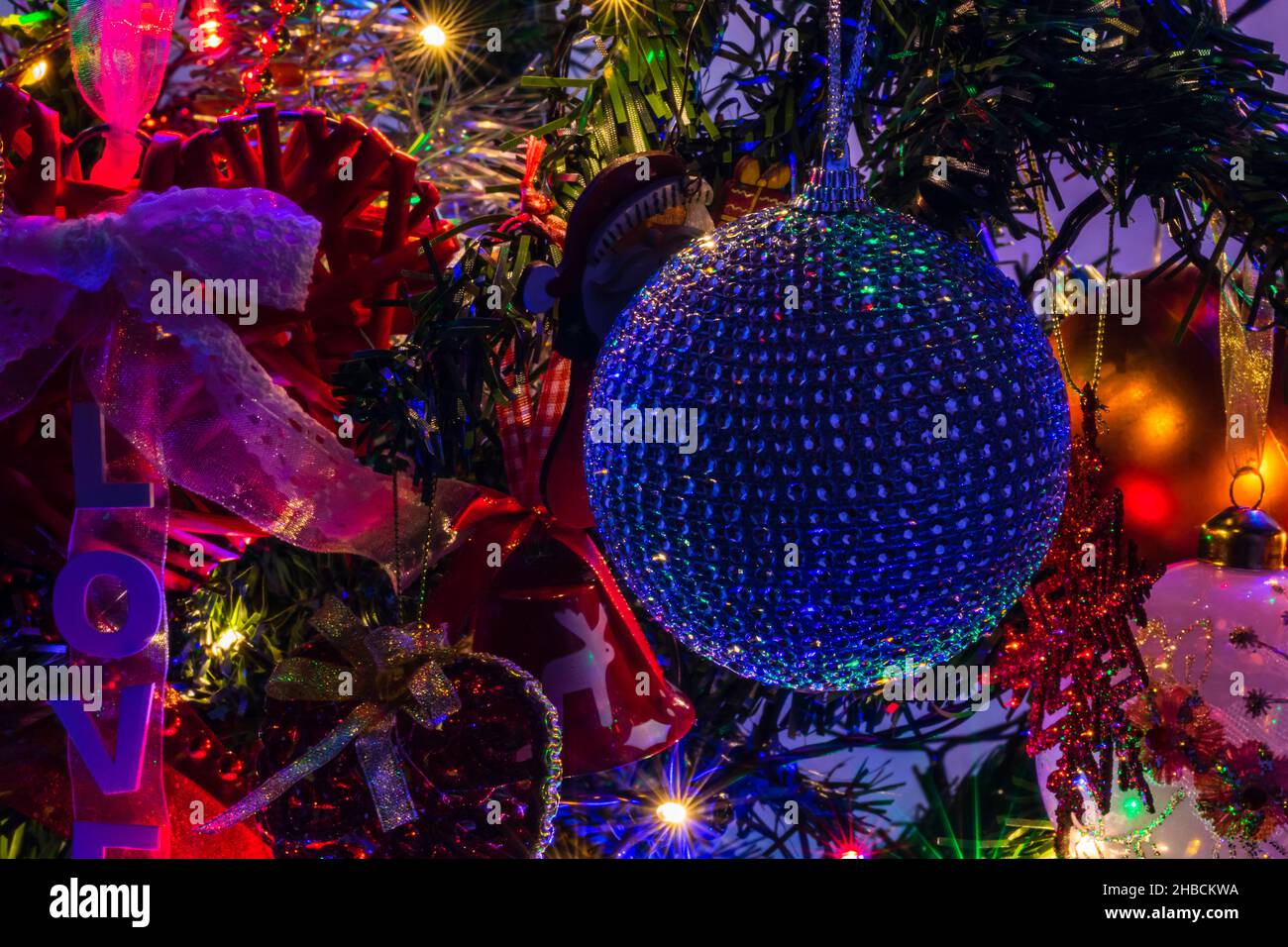 Festive background with glowing decorations on the Christmas tree Stock ...