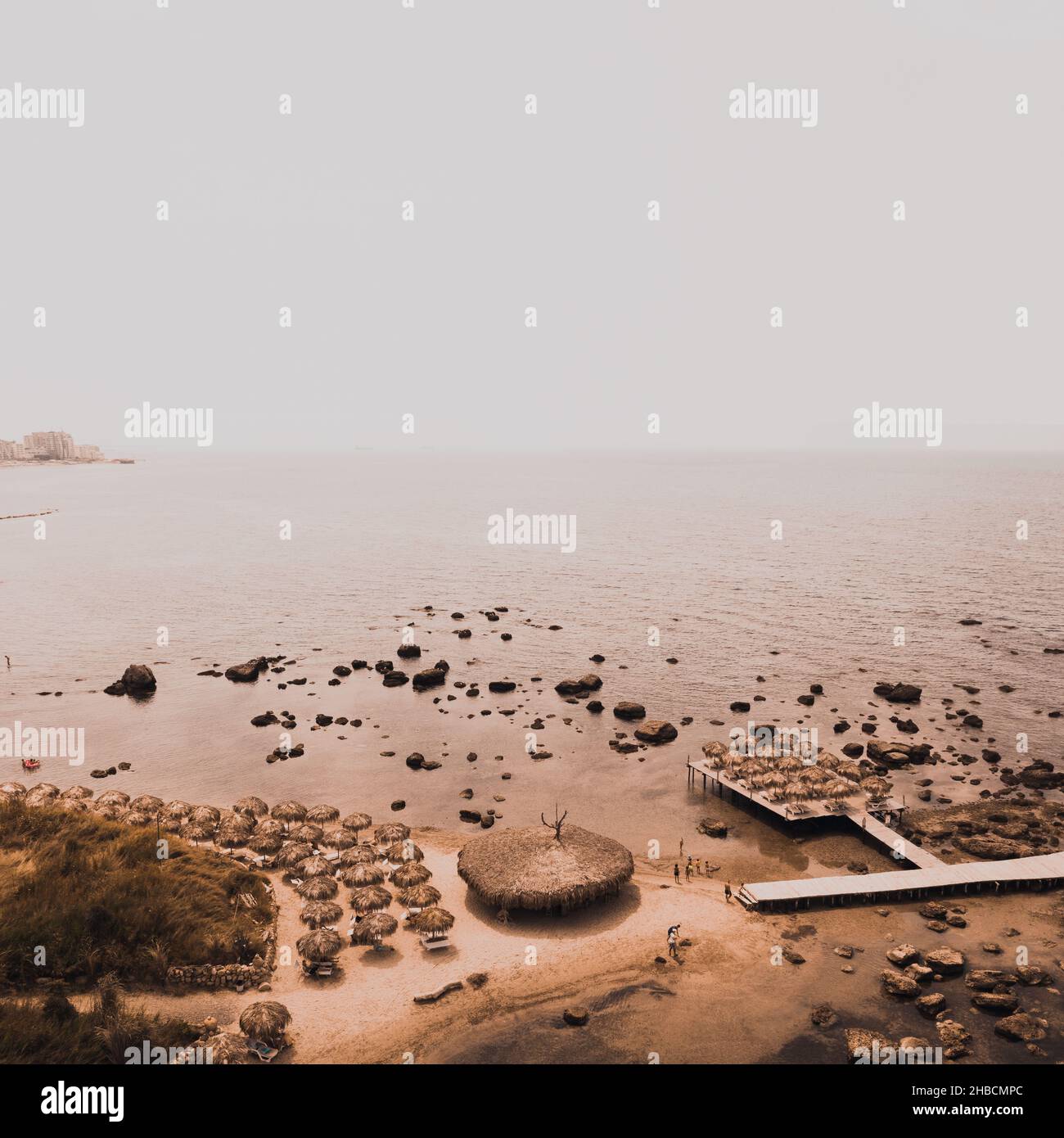 Aerial view of amazing beach with white umbrellas and turquoise sea at ...