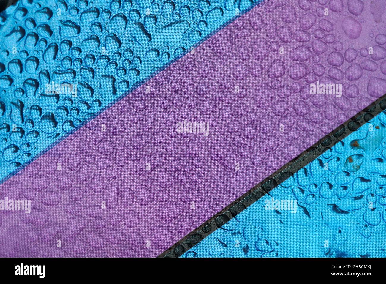 Drops of water on colorful plastic film Stock Photo - Alamy