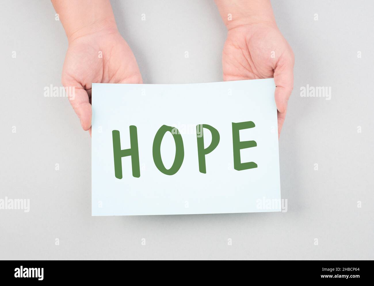 The word hope is standing on a paper, positive mindset, optimism for ...