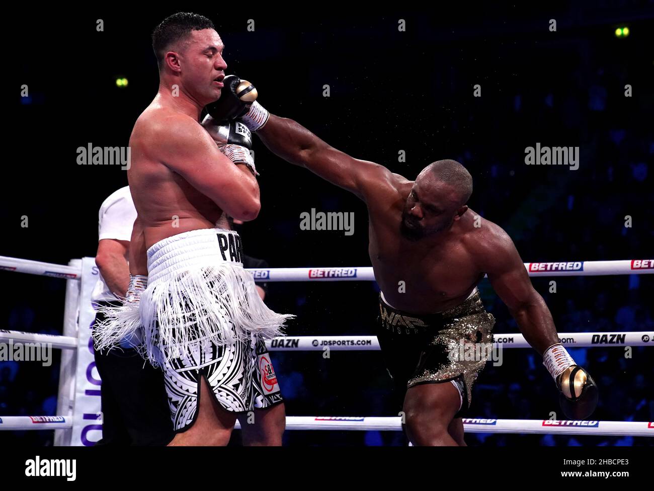 Derek Chisora (right) strikes Joseph Parker during the WBO Intercontinental Heavyweight Title ...