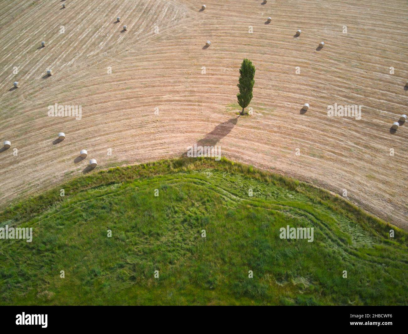 Aerial agriculture and rural farming landscape showing hay bales, crop ...