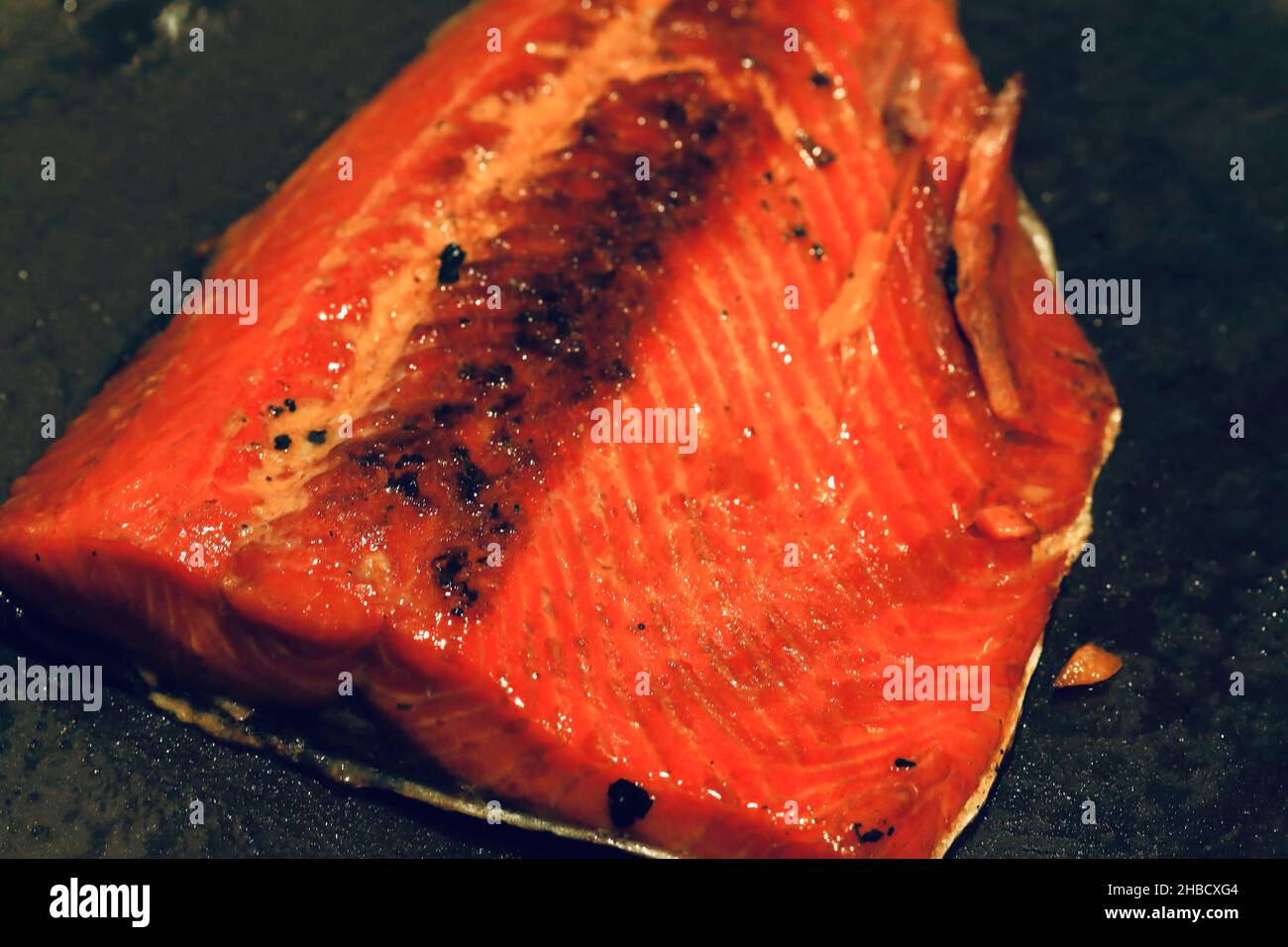 Salmon fish cooking Stock Photo - Alamy