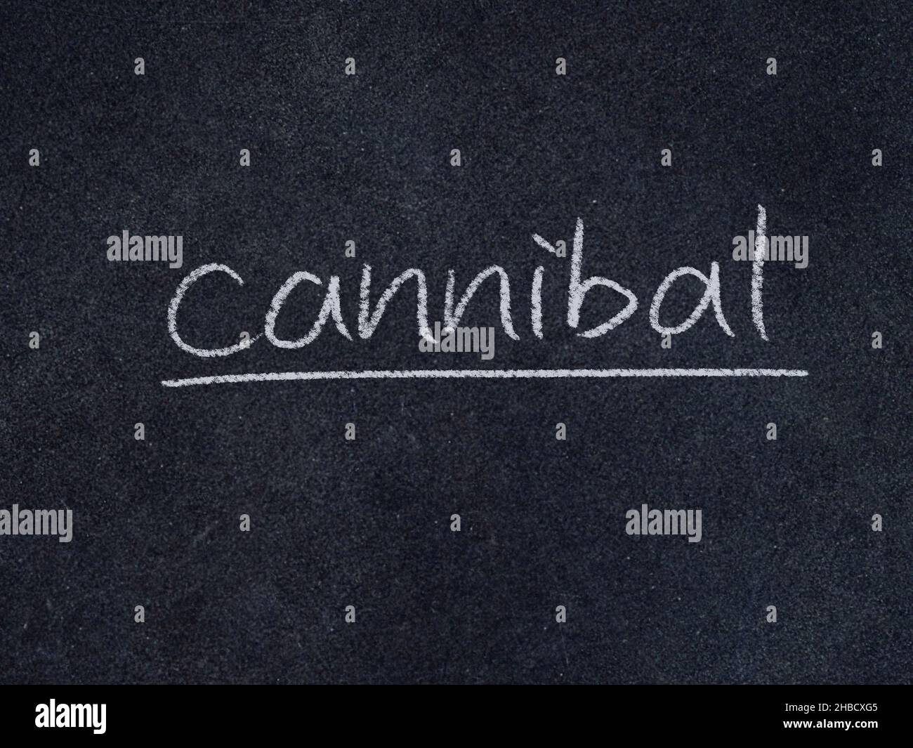 cannibal concept word on blackboard background Stock Photo - Alamy