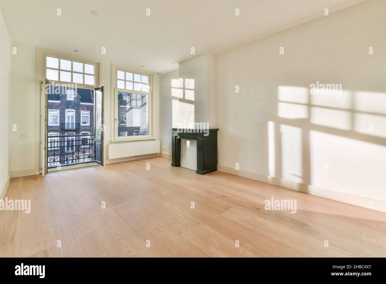 Interior of new apartment, empty living room, wooden floor Stock Photo ...