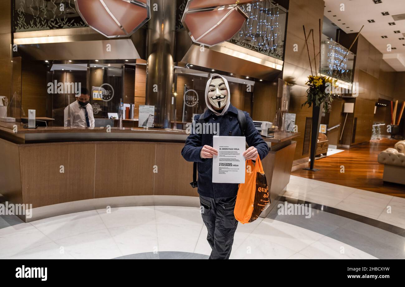 Barcelona, Spain. 18th Dec, 2021. A protester wearing the "V for ...