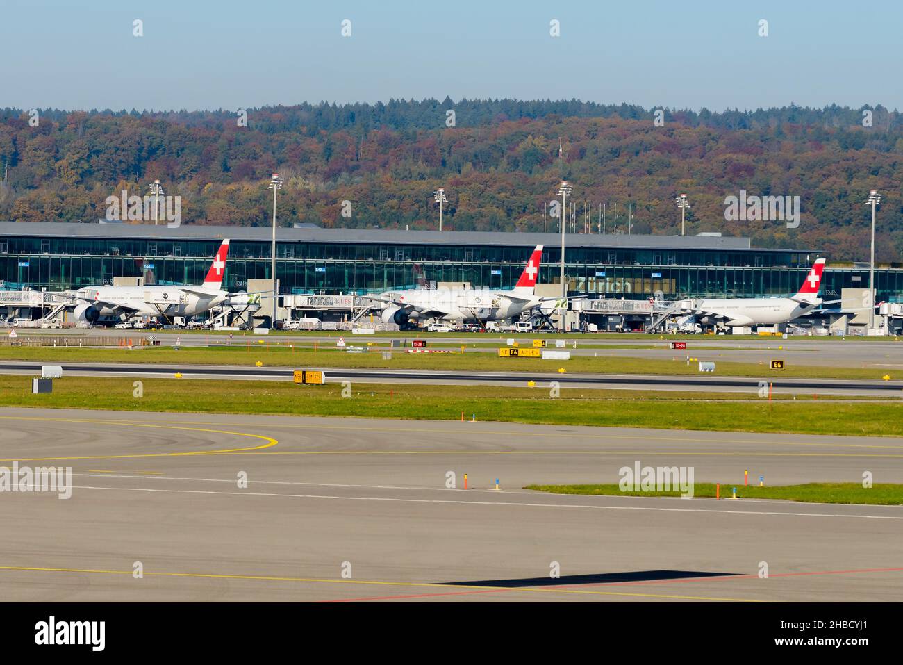 Exterior view of Zurich Airport Terminal Gates E with multiple long ...