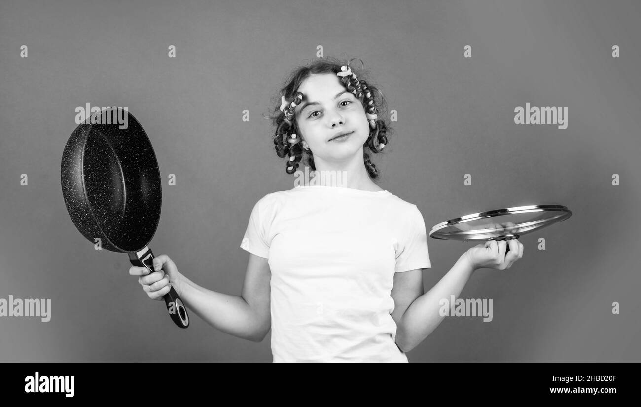 Culinary and house duties. Girl hold Frying Pan. Little kid hold pan ...